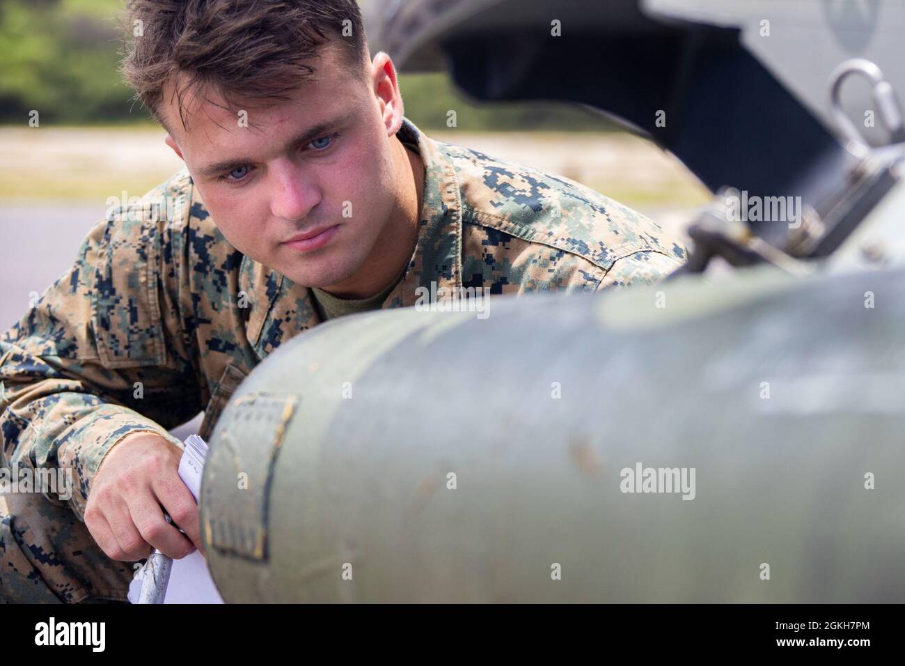 U.S. Marine Corps Cpl. Barton Creed, an ordnance technician with Marine ...