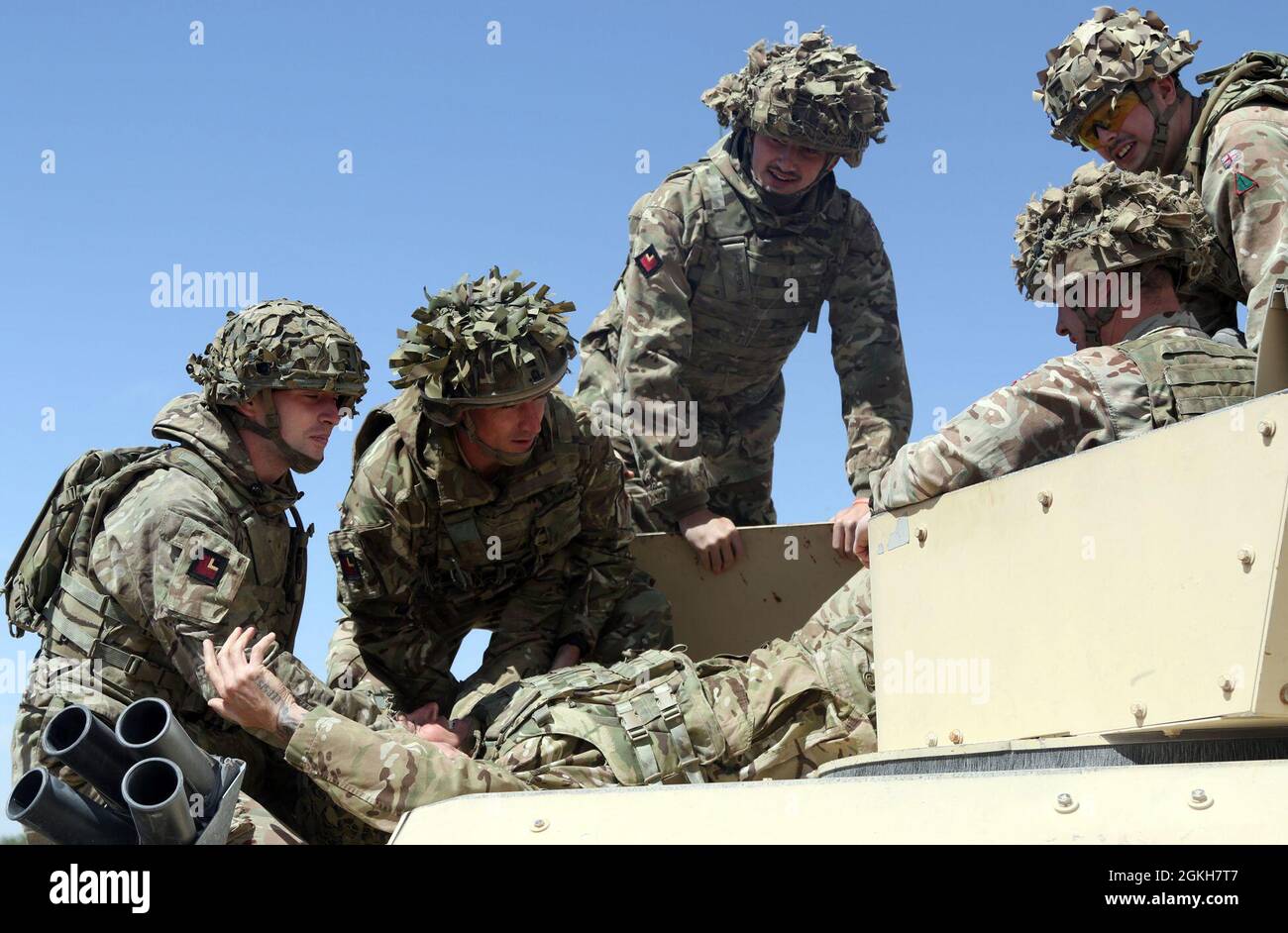 Soldiers with the British Army practice how to evacuate a casualty from ...