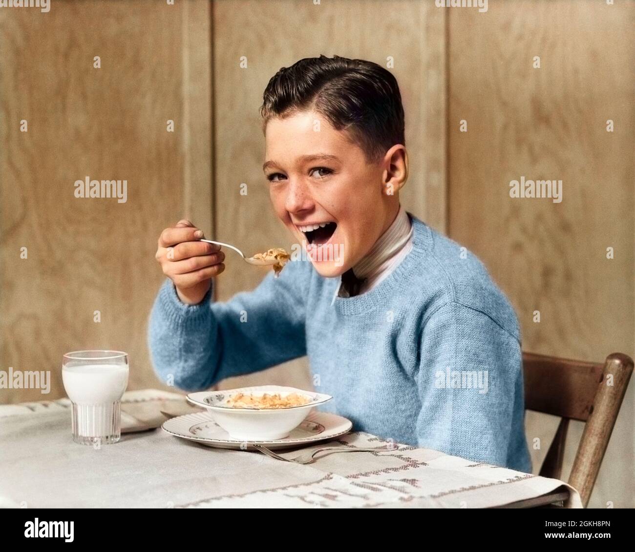 1930s 1940s SMILING HUNGRY BOY LOOKING AT CAMERA EATING BREAKFAST BOWL ...