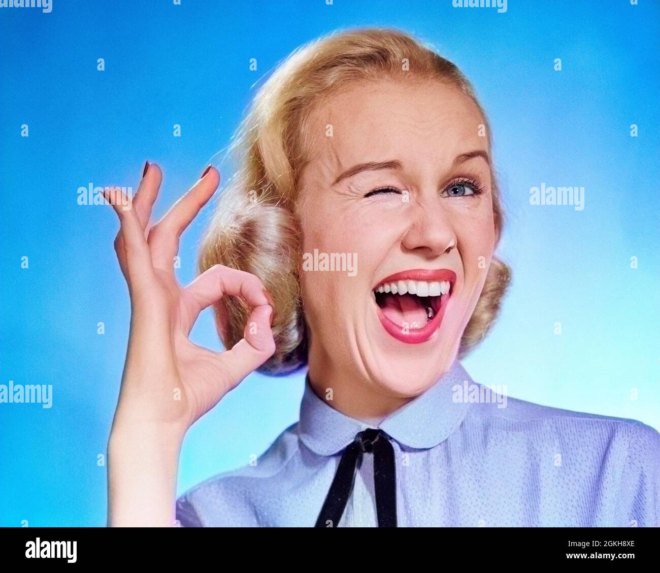 Blond smile smiles thumb agree agreement hi-res stock photography and ...