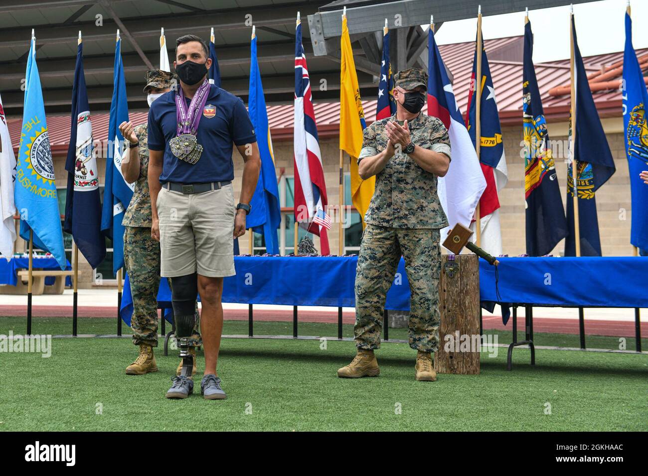 U.S. Marine Corps Capt. Thomas Benge accepts an award during the 2021 ...