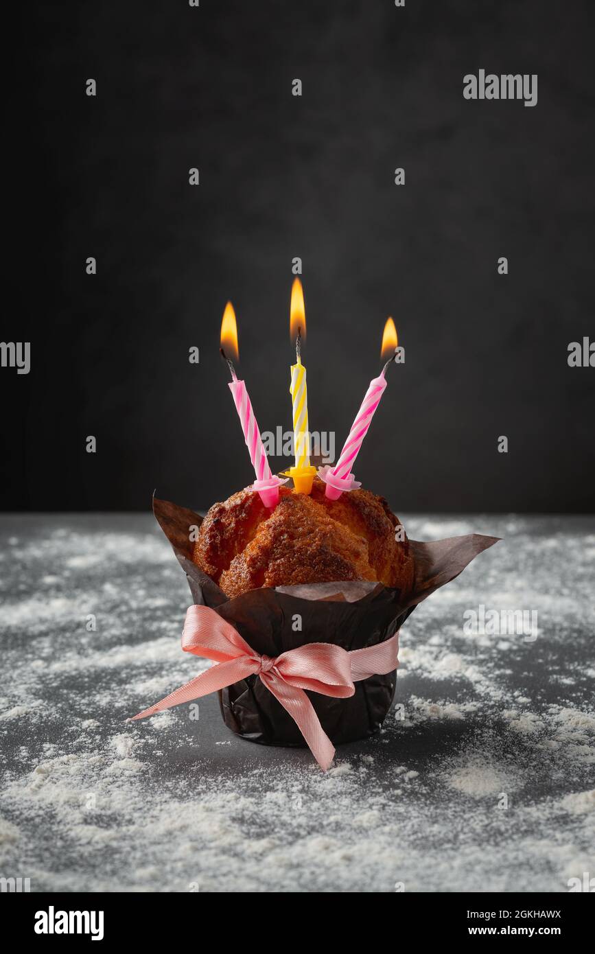 Birthday Muffin. Cupcake and pink ribbon, grey background with copy ...