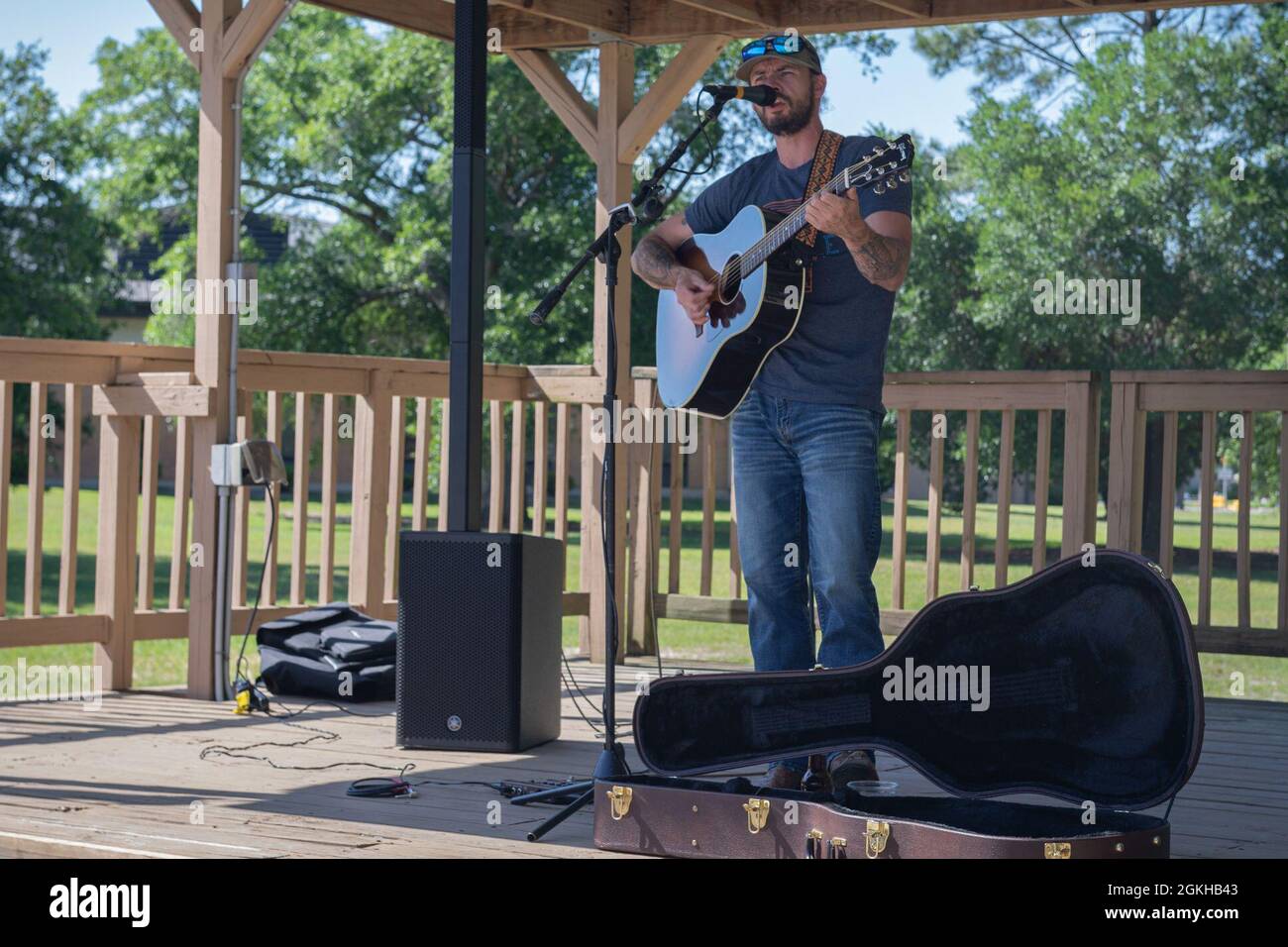 Zach Lambert, musical performer, sings during the Moody Field Club deck ...
