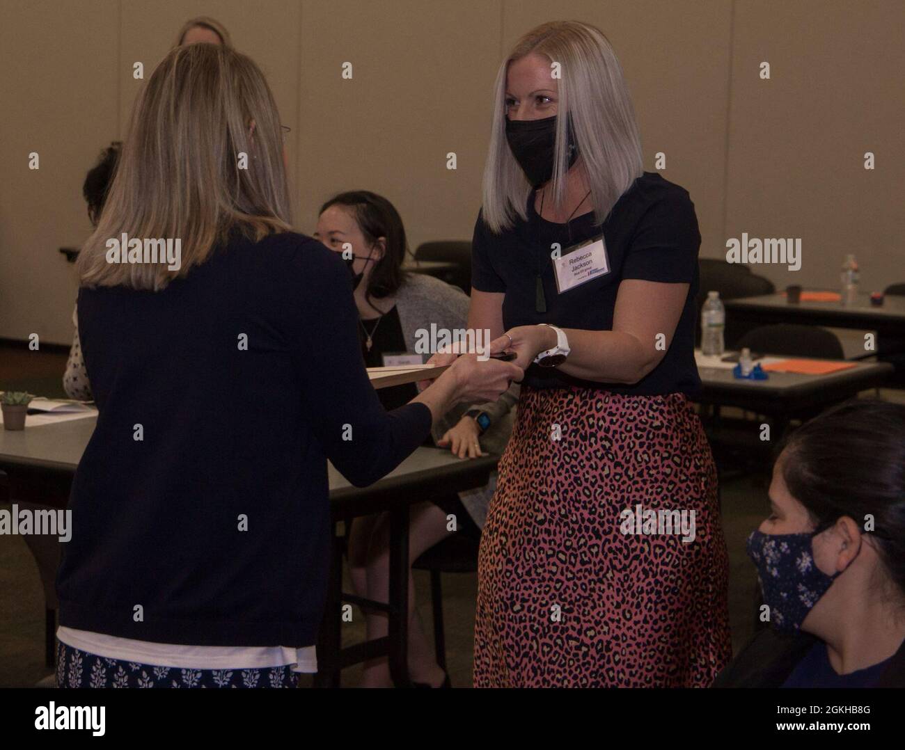 Rebecca Jackson (right), receives a graduation award during the ...