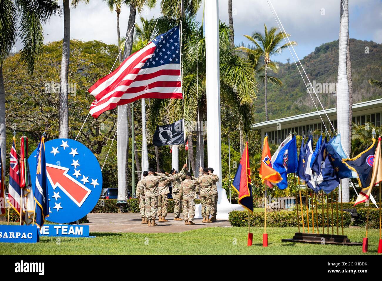 U.S. Army Pacific Soldiers salute the post flag April 22 during the ...