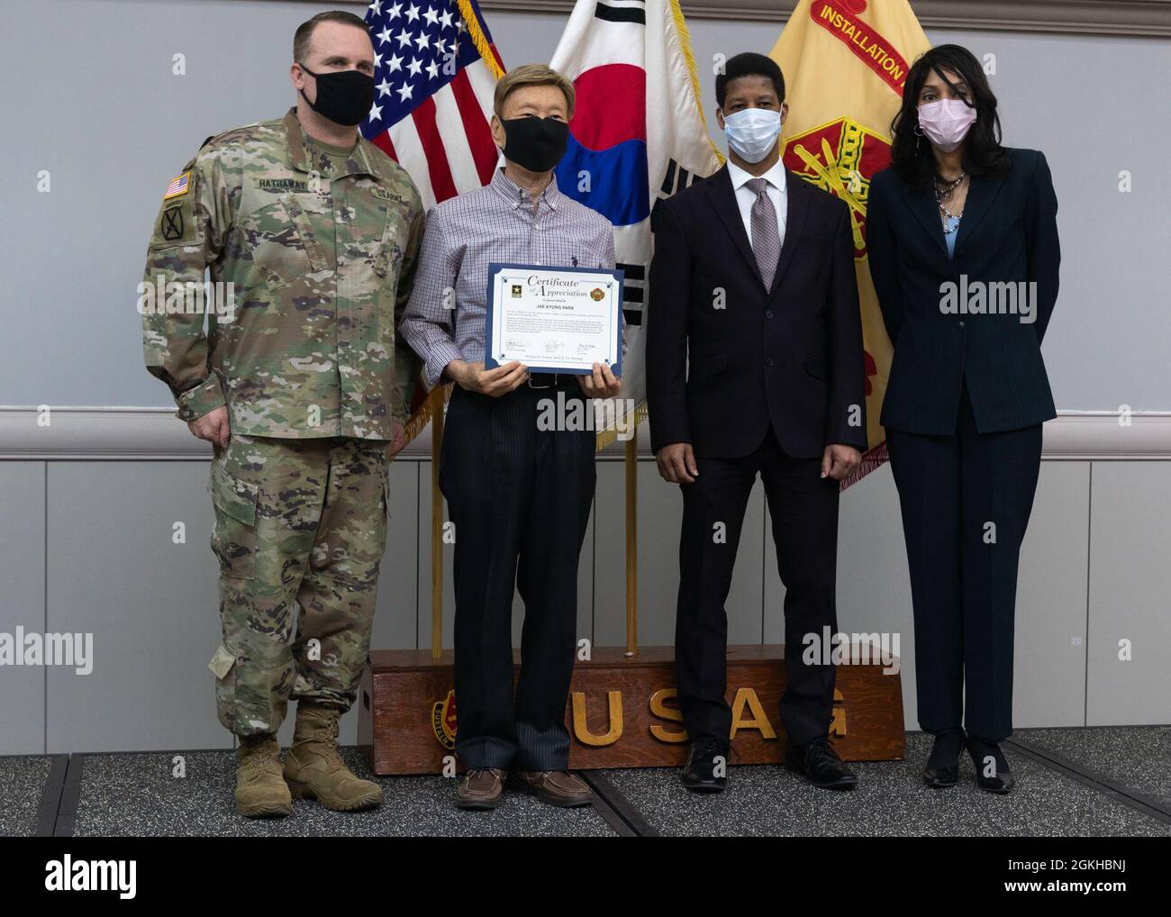 U.S. Army Ret. Command Sgt. Major Jae Park receives a Certificate of ...