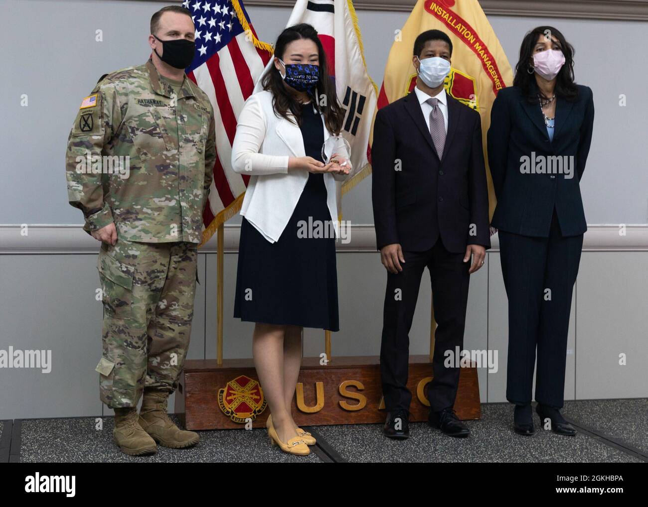 Ms. Sujin Yoon receives the Active Duty Family Member Volunteer of the ...