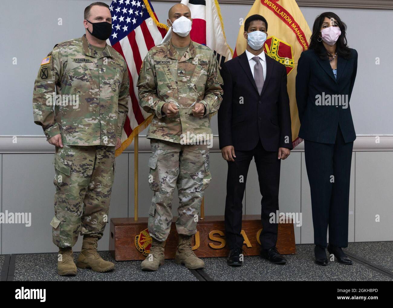 U.S. Army Sgt. Brandon Jackson, HHS USAG Yongsan receives an award from ...