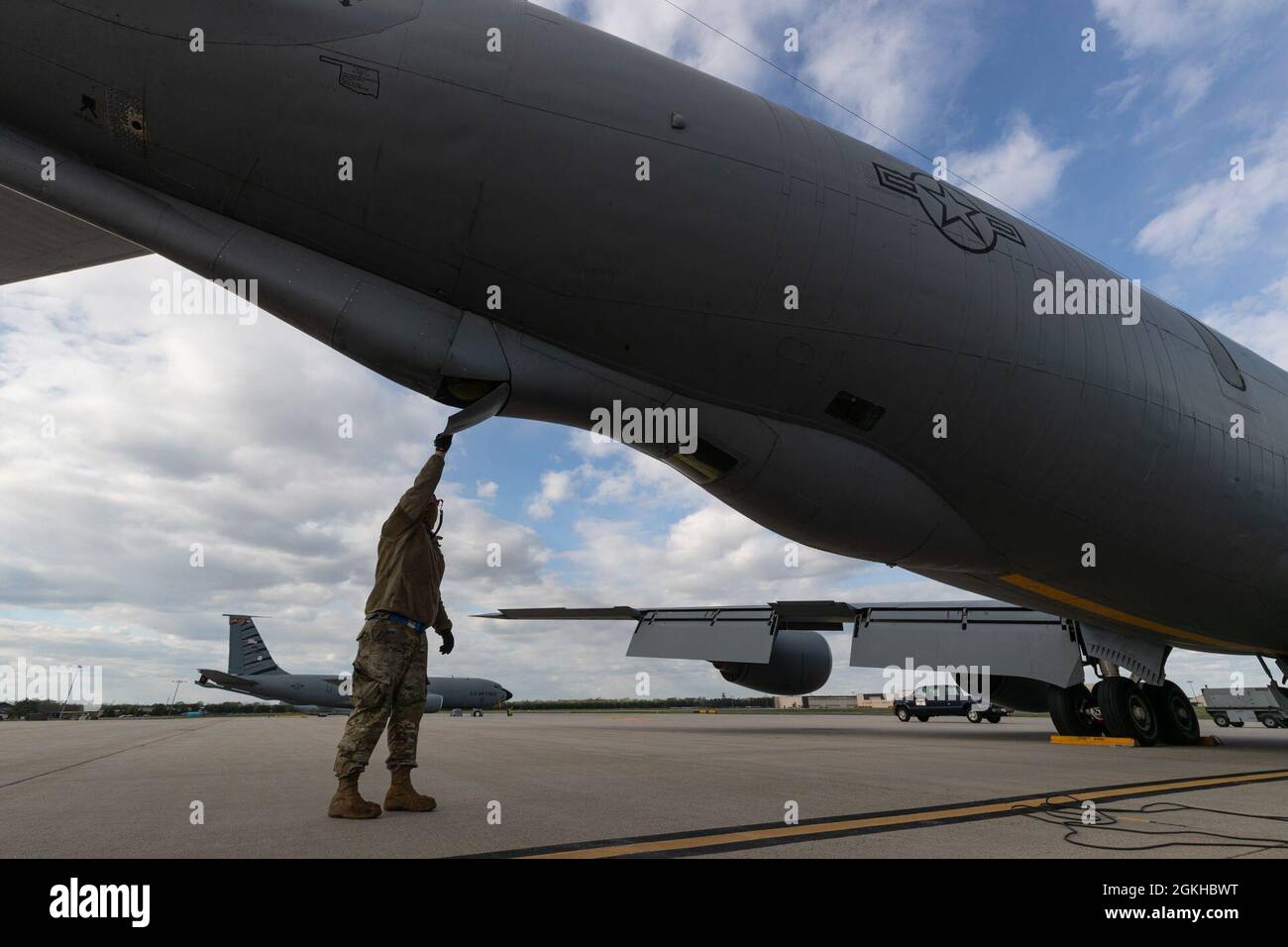 Maintenance Airmen with the 108th Wing check over aircraft before a ...
