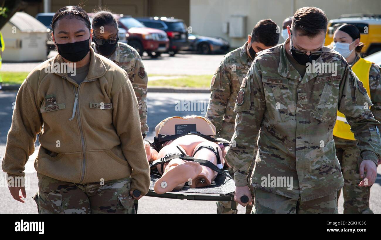 Second Medical Group Airmen litter carry a simulated casualty during ...