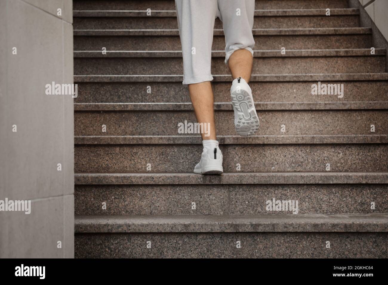 Sporty man running stairs outdoors Stock Photo - Alamy