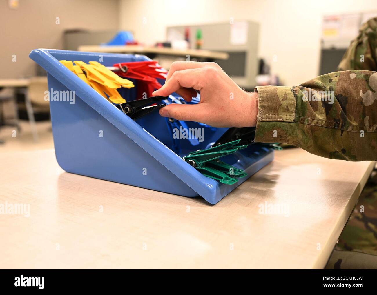 A patient works on finger strength and dexterity training at Wilford ...