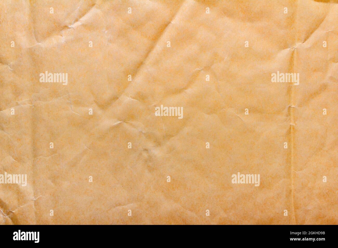 Texture backdrop photo of yellow colored crumbled packing paper surface ...