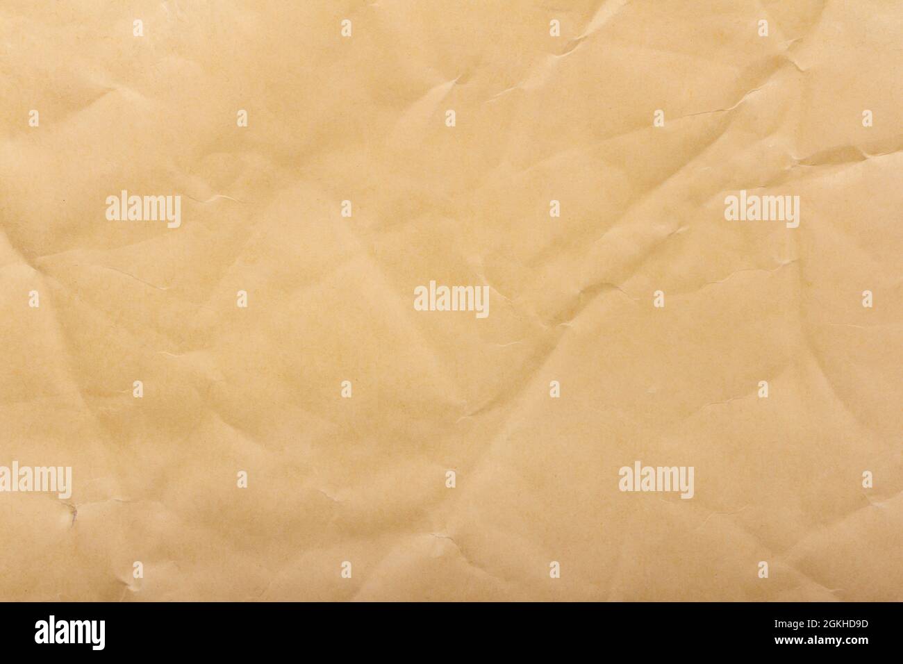 Texture backdrop photo of yellow colored crumbled packing paper surface ...