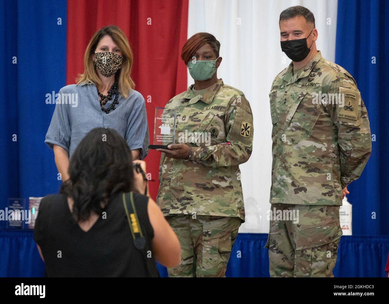 Awardee Sgt. 1st Class Cheryl Hamiltion is flanked by Jayne Bernabe, an ...