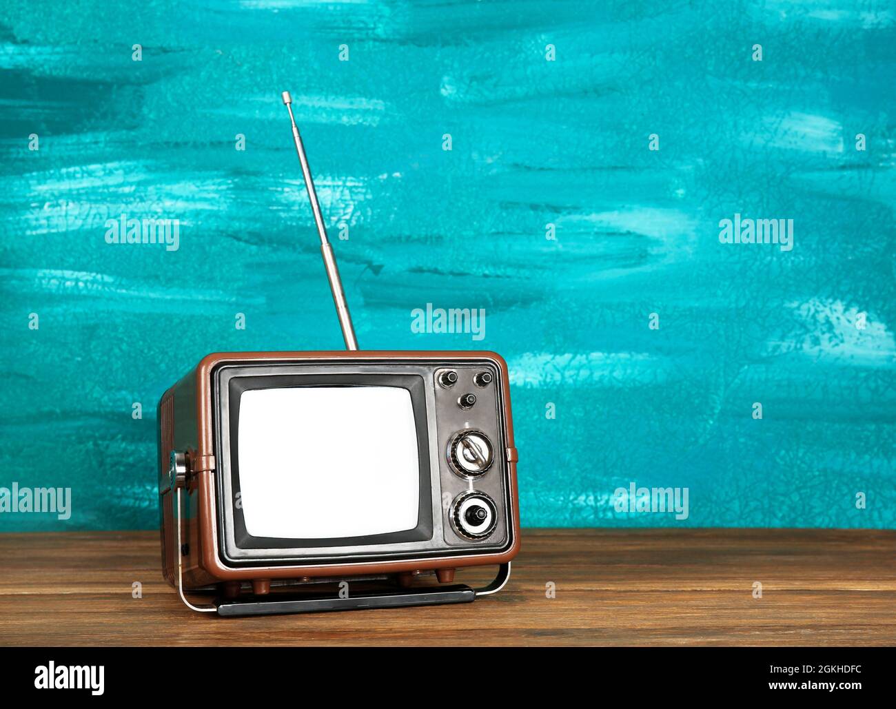 Retro TV on color background Stock Photo - Alamy