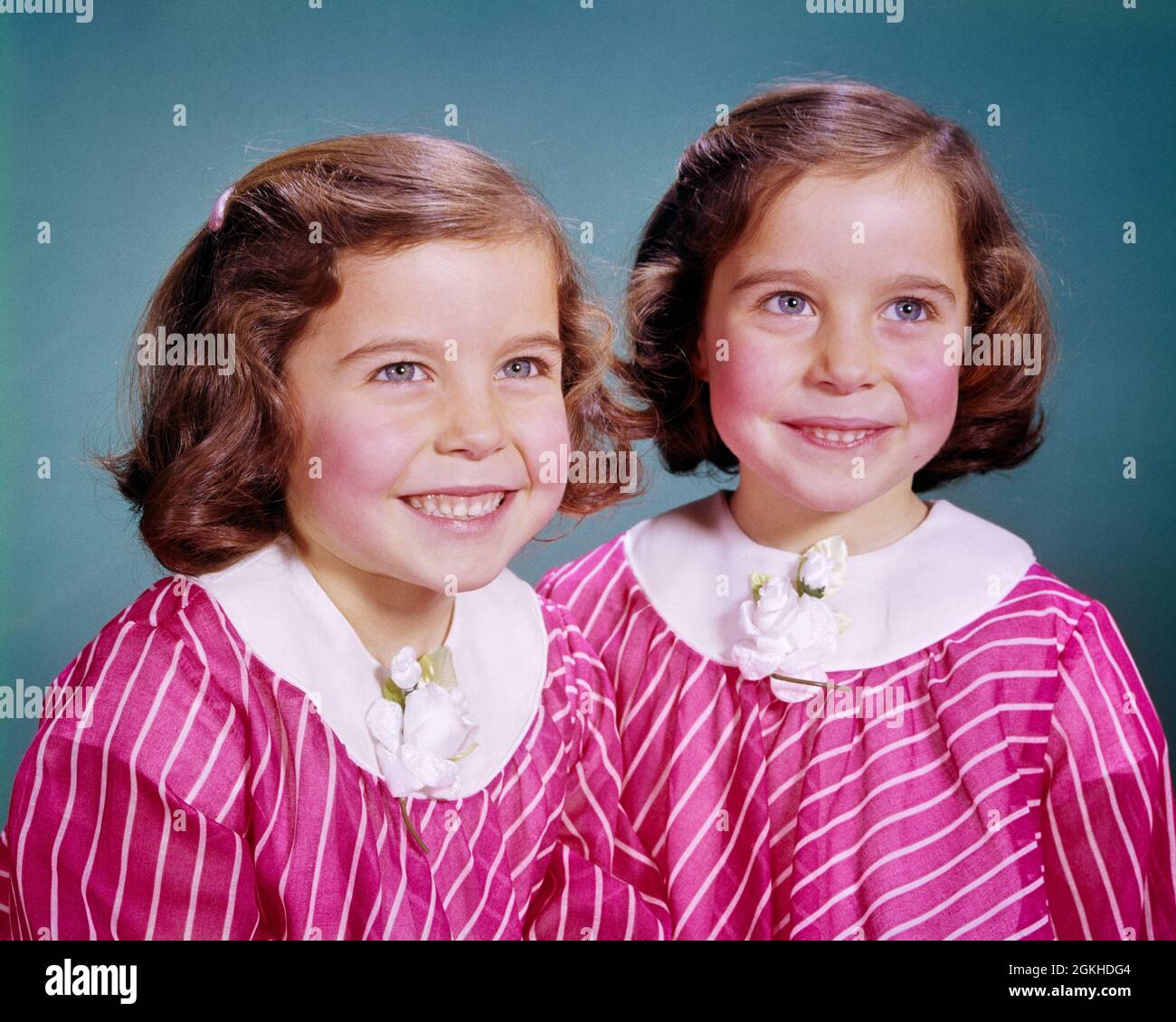 Twin children wearing matching clothes hi-res stock photography and ...