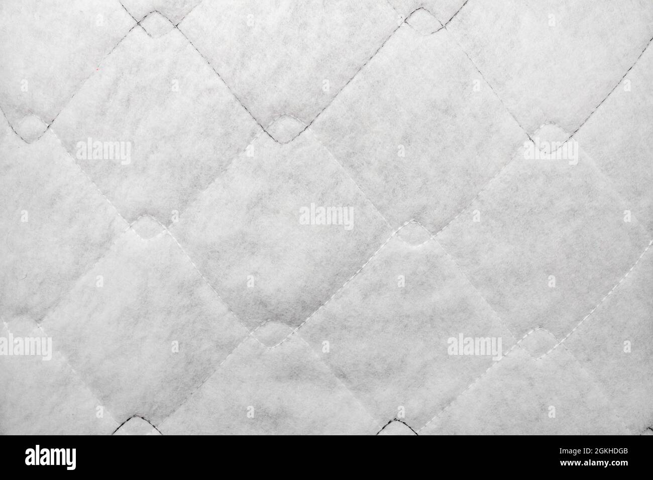Texture backdrop photo of white colored sintepon fibers material with ...