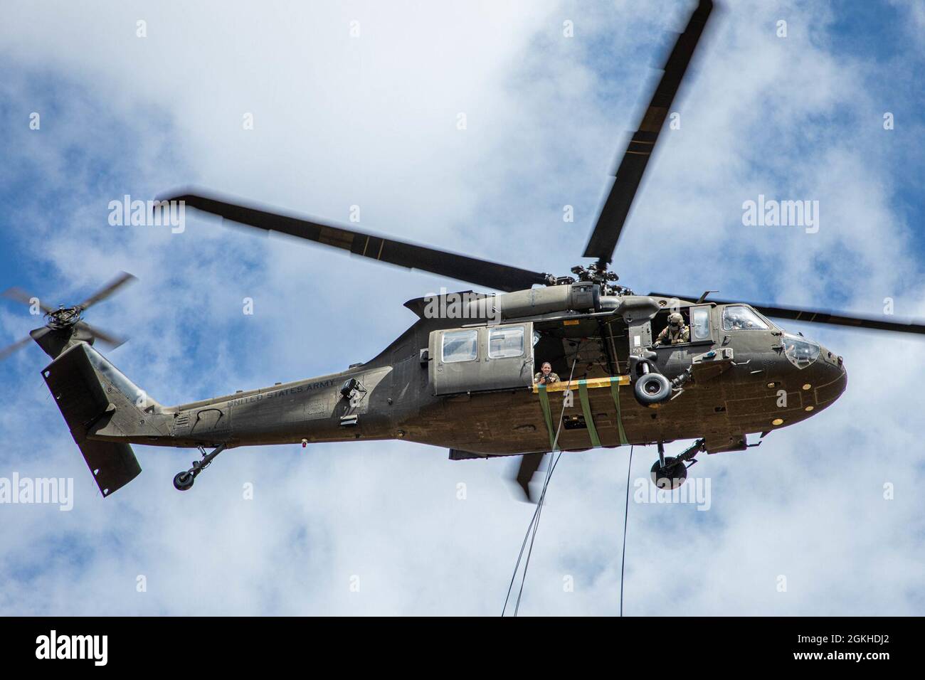 25th Infantry Division Soldiers rappel from a UH-60 Black Hawk during a ...