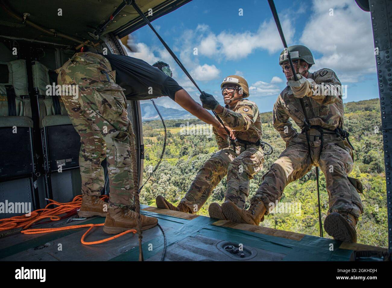 25th Infantry Division Soldiers rappel from a UH-60 Black Hawk during a ...