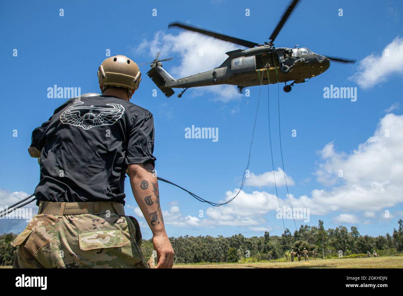 25th Infantry Division Soldiers rappel from a UH-60 Black Hawk during a ...
