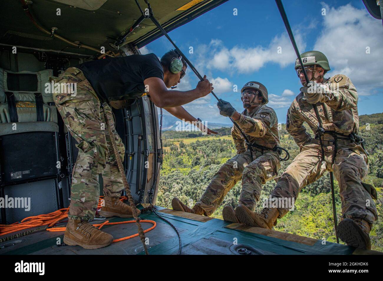 25th Infantry Division Soldiers rappel from a UH-60 Black Hawk during a ...