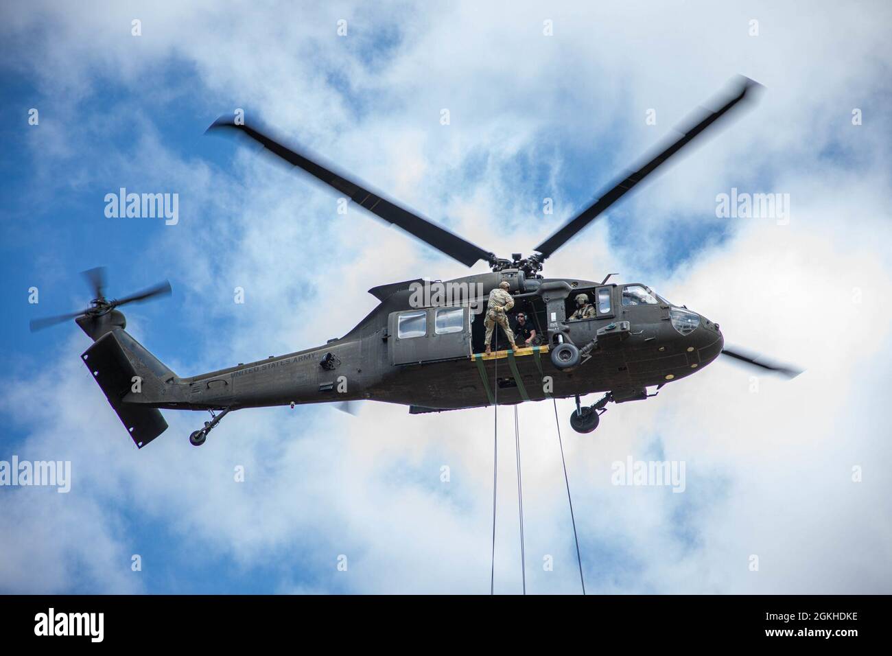 25th Infantry Division Soldiers rappel from a UH-60 Black Hawk during a ...