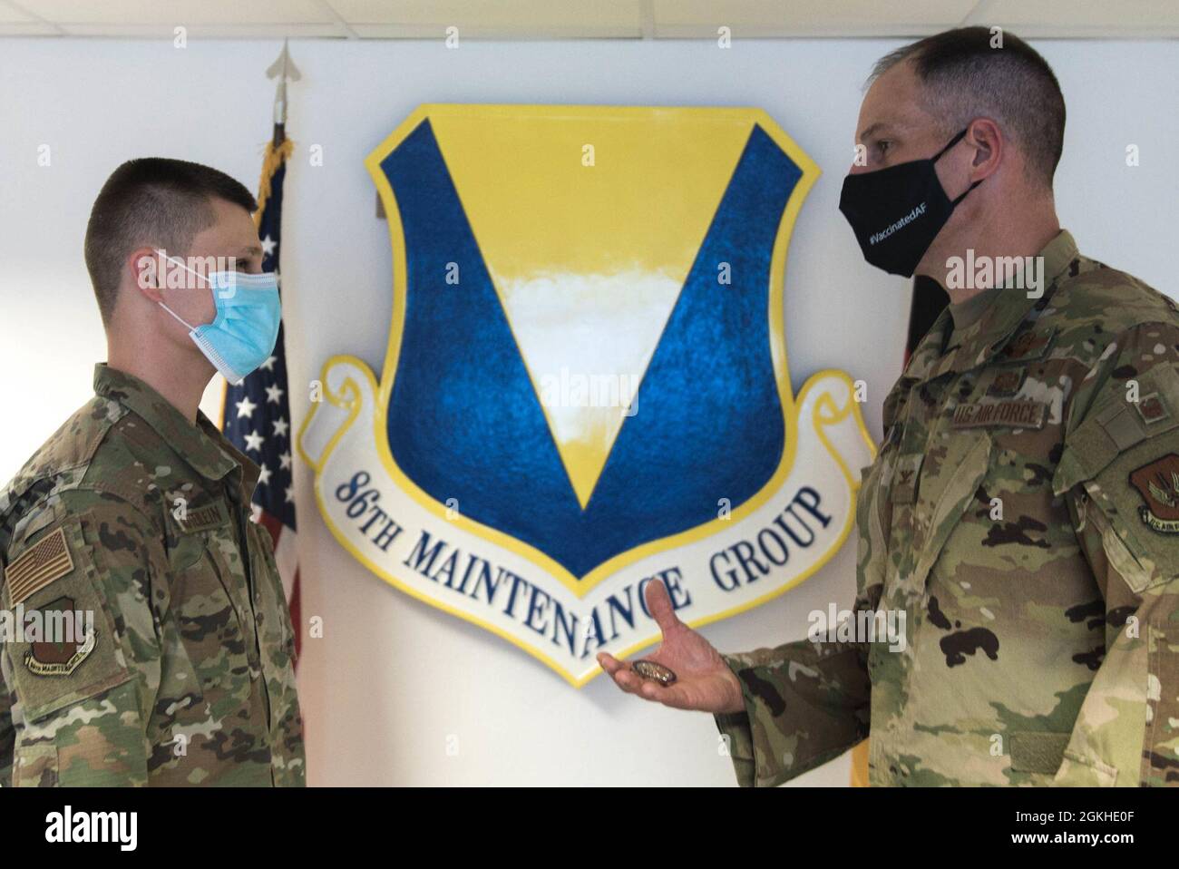 86th Airlift Wing vice commander, coins Tech. Sgt. Matthew Lauterlein ...