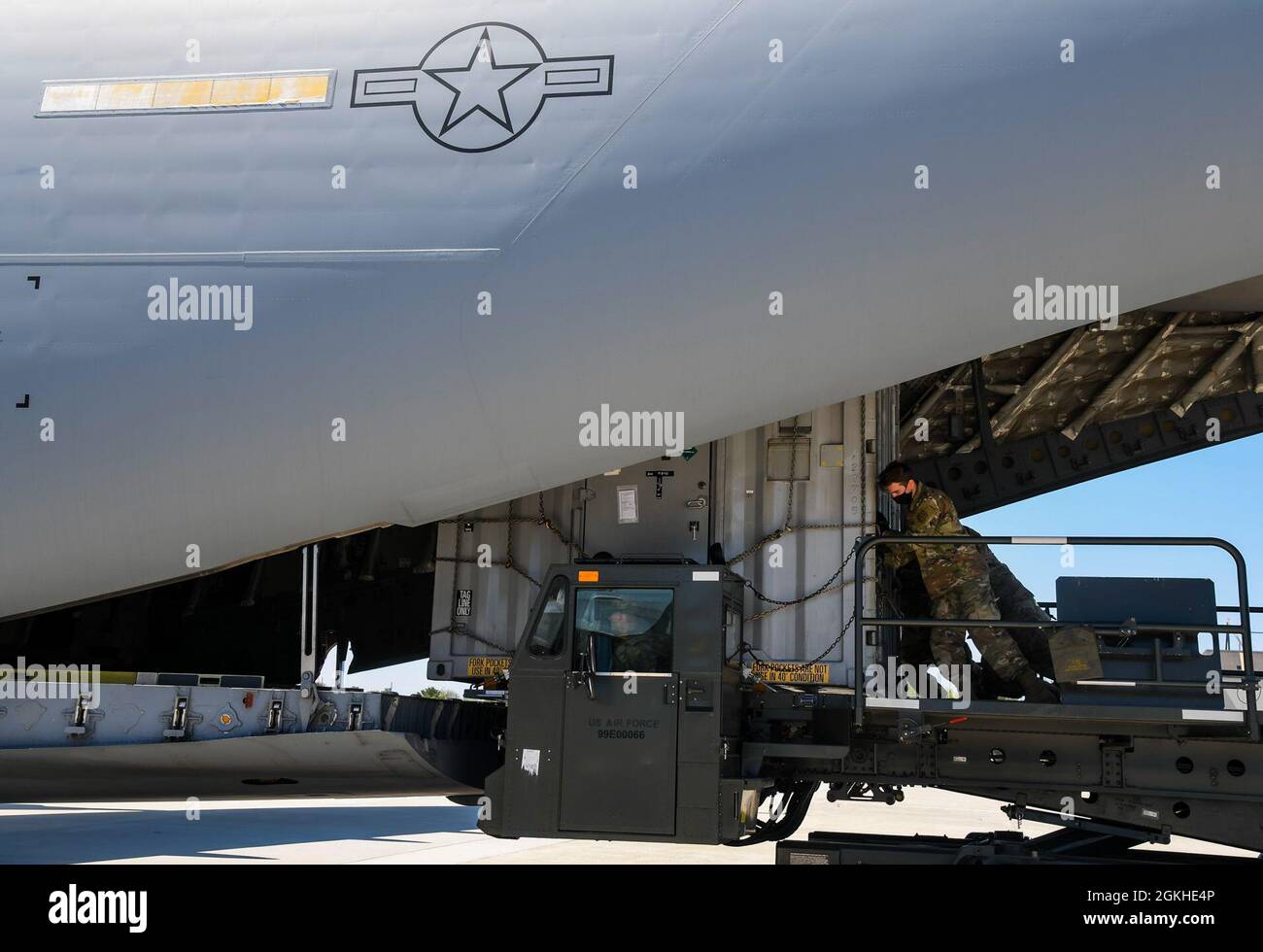 Airmen from the 436th Aerial Port Squadron load cargo onto a C-17 ...