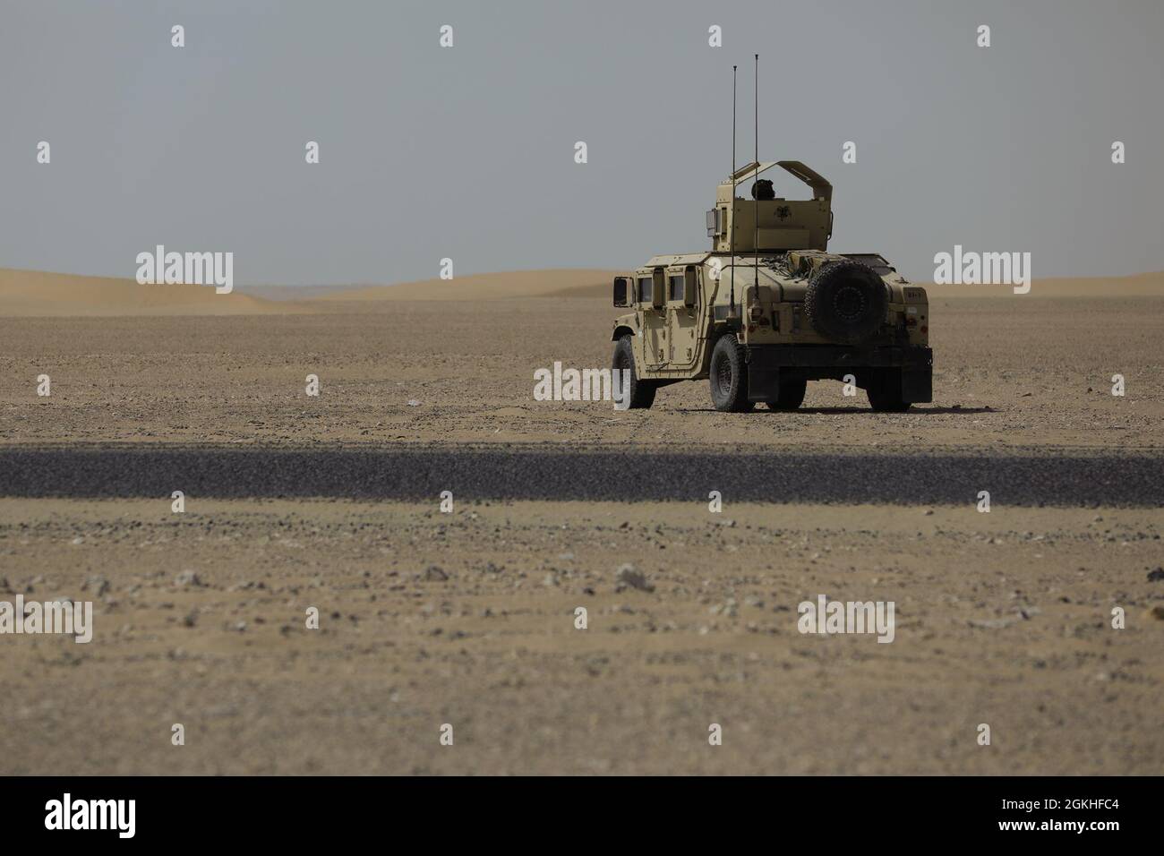 An U.S. Army M1114 HMMWV (humvee) takes a security posture during a ...