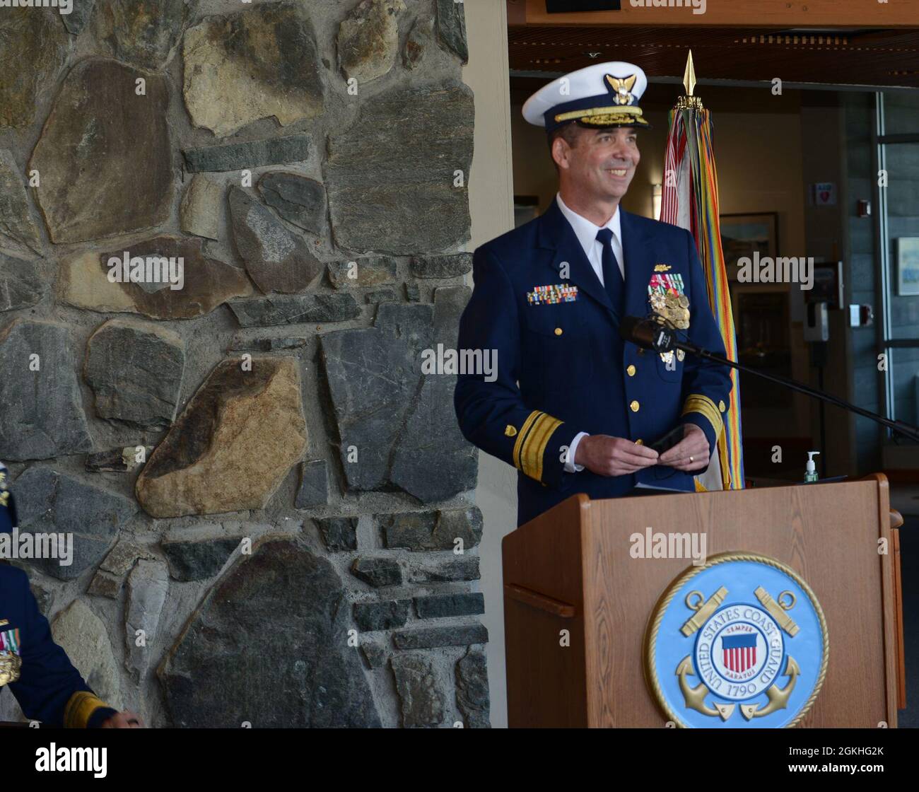 Rear Adm. Nathan A. Moore speaking at the Coast Guard 17th District ...