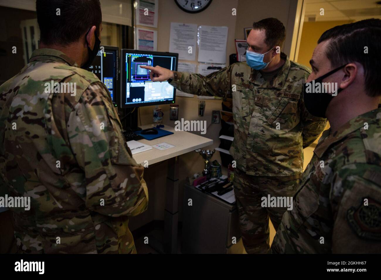 U.S. Air Force Tech. Sgt. Christopher Moore, center, 60th Diagnostics ...