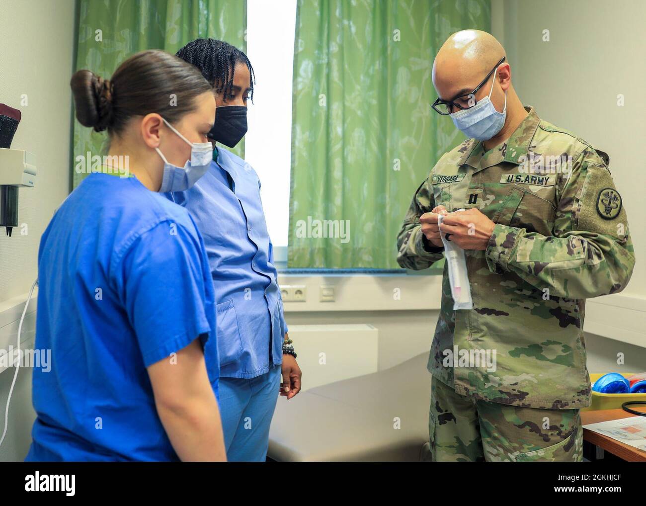 U.S. Army Capt. Mario Vergara (right), clinical nurse officer in charge ...