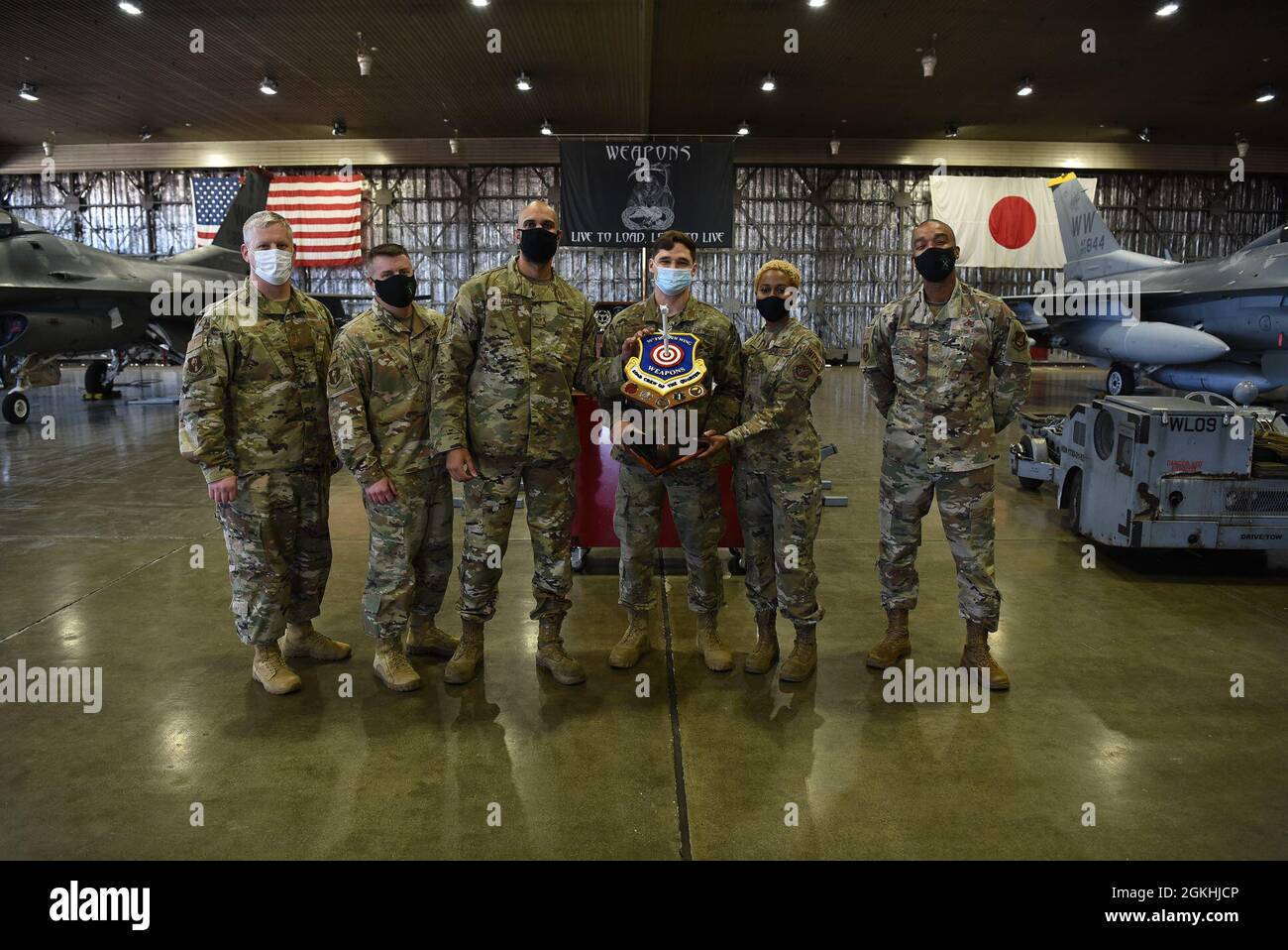 U.S. Air Force Airmen with the 13th Aircraft Maintenance Unit receive a ...