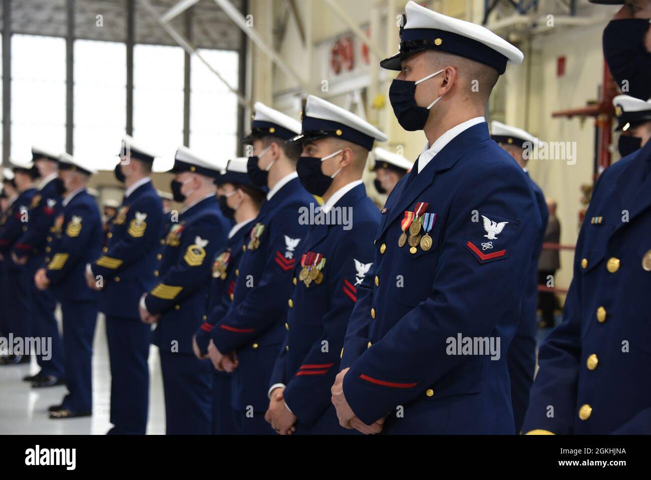 Members from Coast Guard Cutter Douglas Munro (WHEC 724) stand in ...