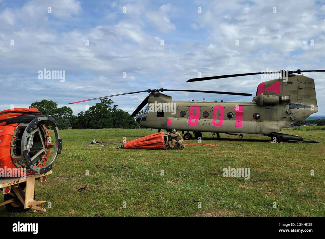 A California Army National Guard soldier inspects a helicopter bucket ...