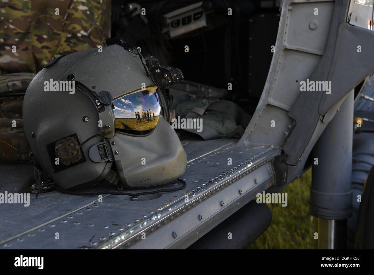 A California Air National Guard flight helmet reflects a Military ...