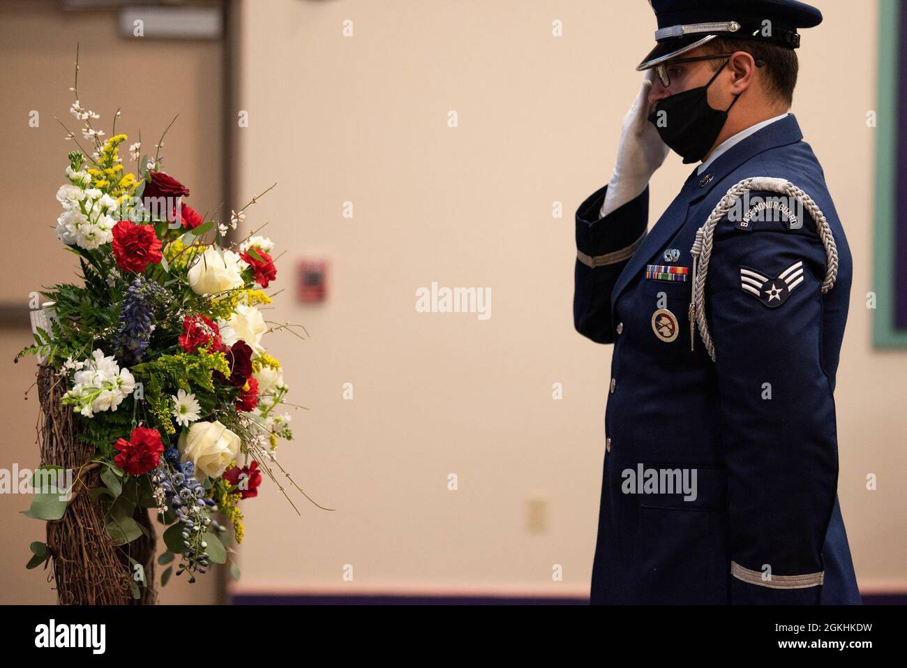 A base honor guard member salutes a wreath during the 41st Eagle Claw ...