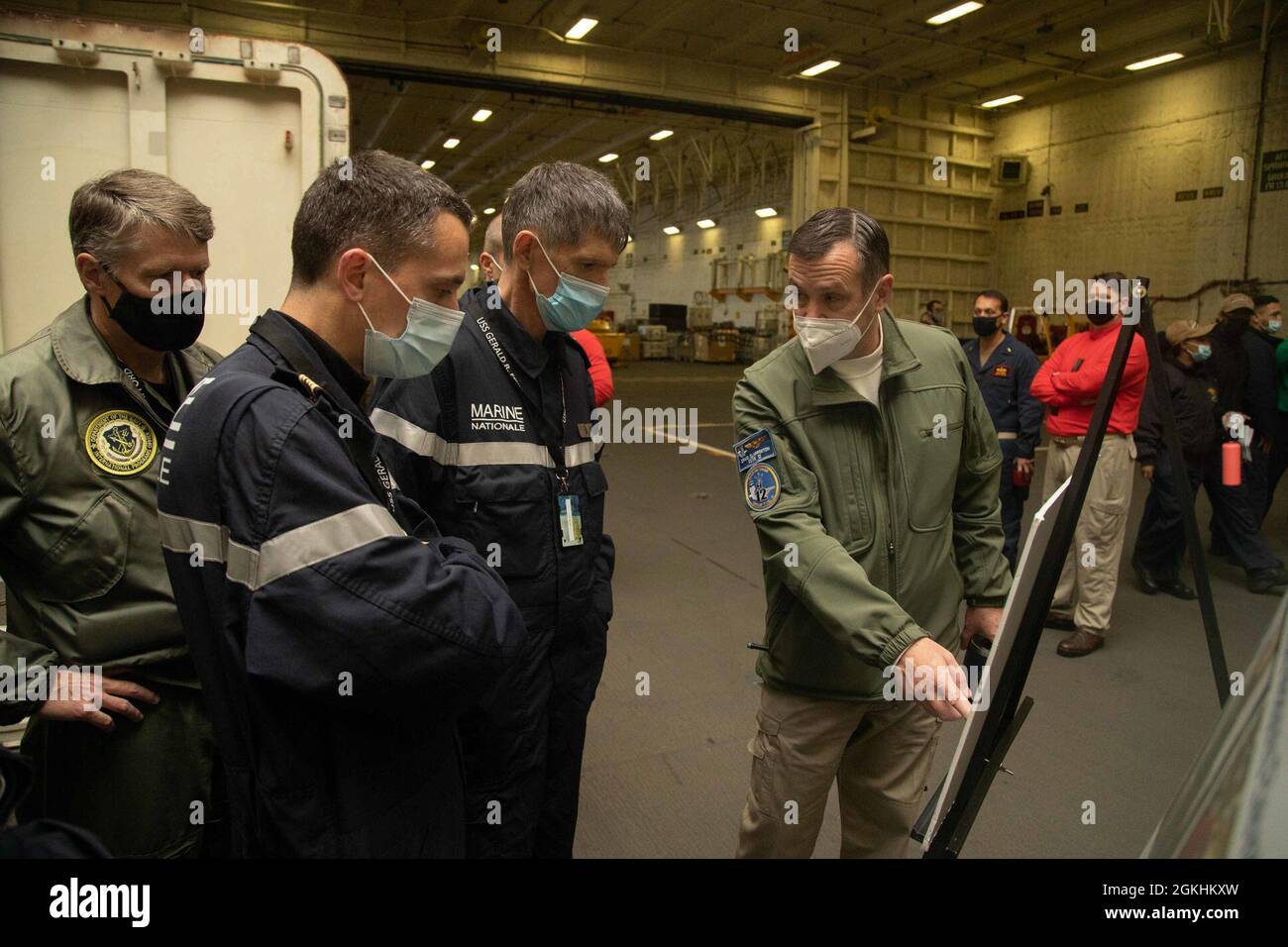 Rear Adm. Craig Clapperton, right, commander, Carrier Strike Group (CSG ...