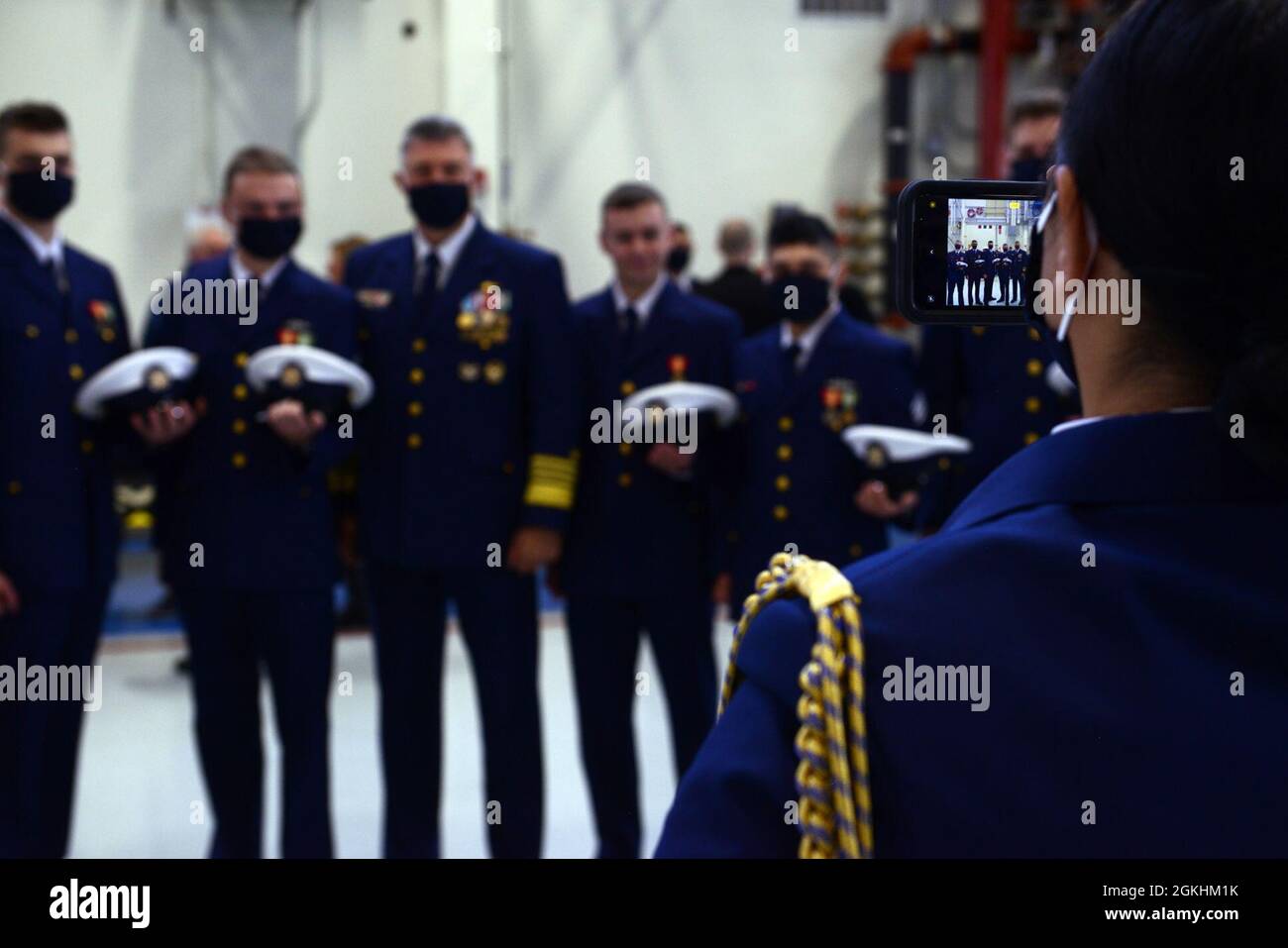 Coast Guard Commandant Adm. Karl L. Schultz poses for a group photo ...
