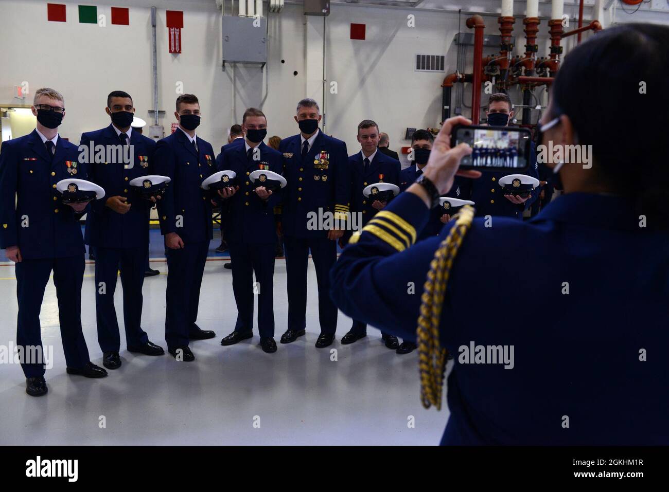 Coast Guard Commandant Adm. Karl L. Schultz poses with a group of Coast ...