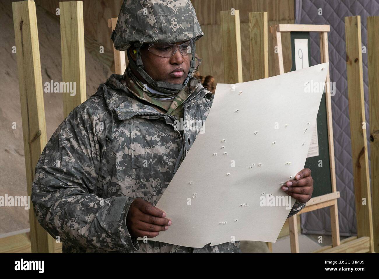 Spc. Ben Toler, a saxophone player with the 484th Army Band, looks over ...