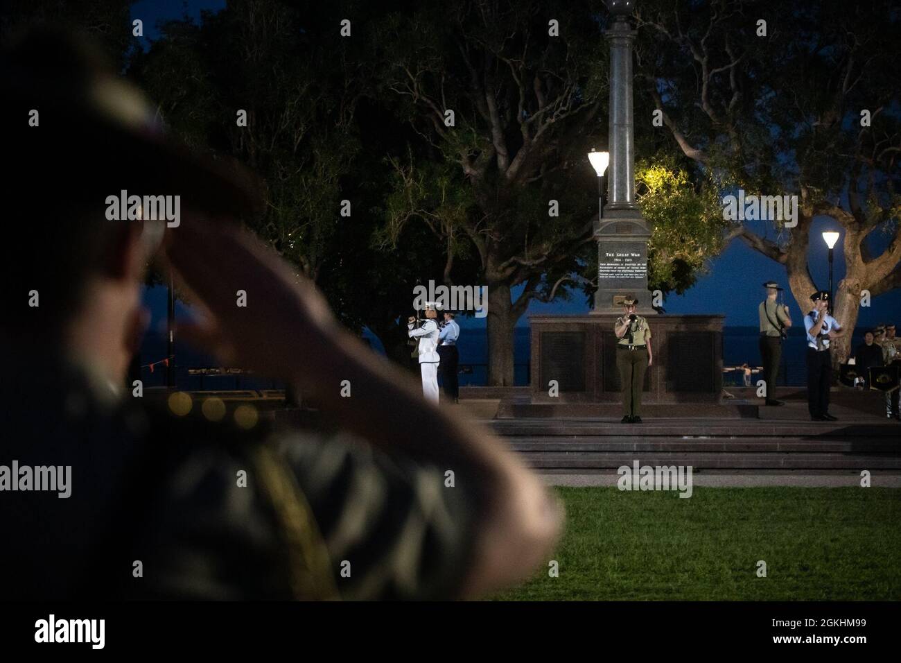 An Australian Defence Force service member salutes during the playing ...