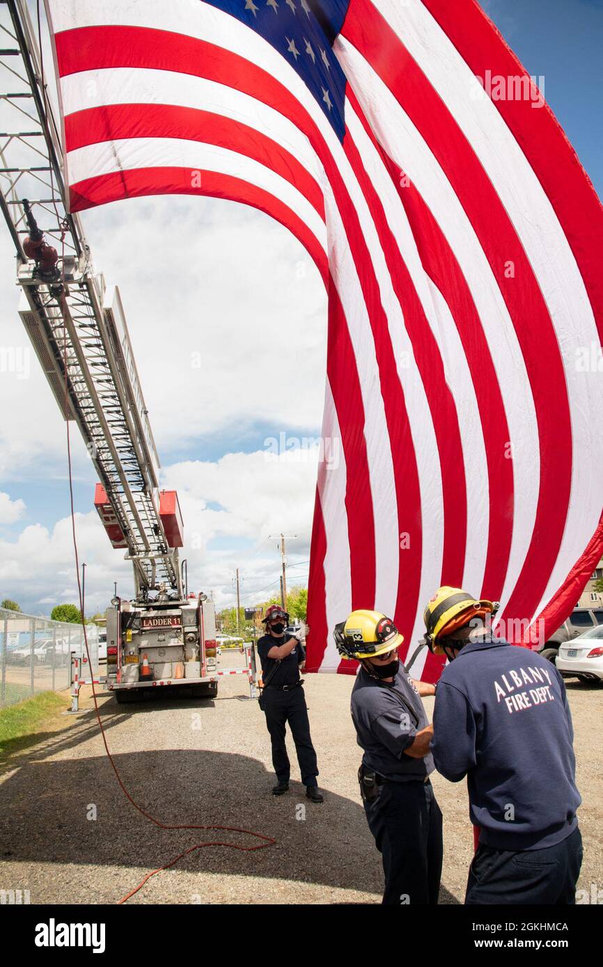 Firefighters from the Albany Fire department, Albany, Ore., outfit a ...