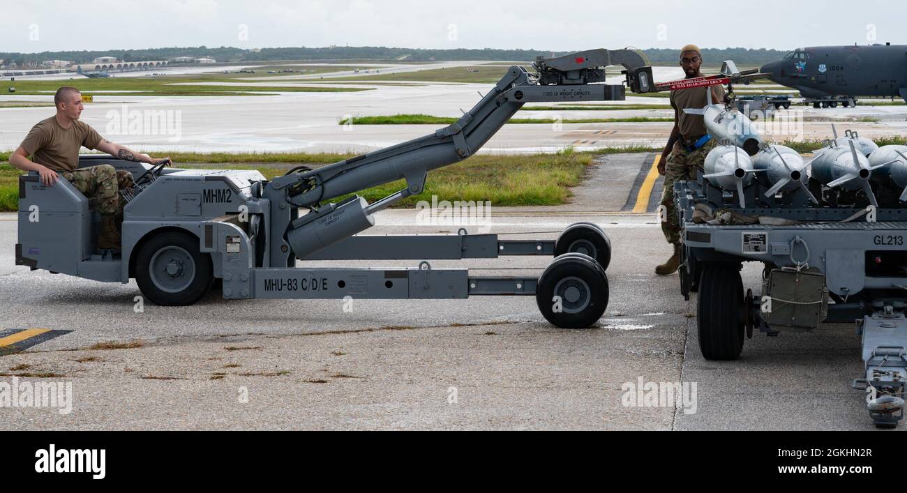 U.S. Air Force Airmen transport a BDU-50 chronicle bomb to a B-52H ...