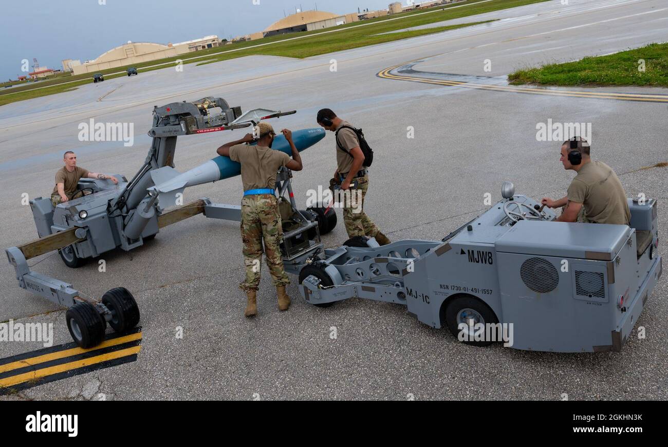 U.S. Air Force Airmen transport a BDU-50 chronicle bomb to a B-52H ...