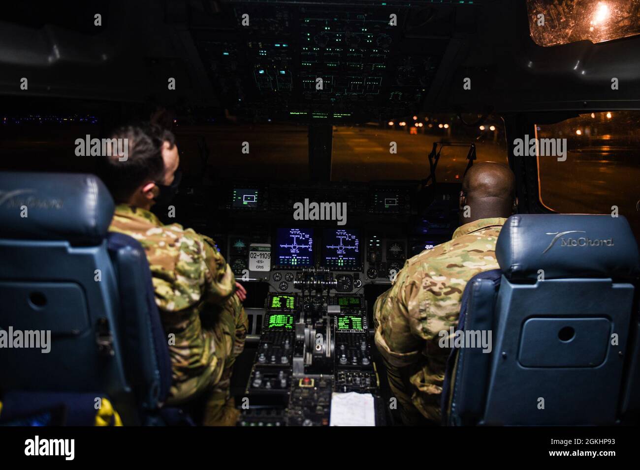 From left, U.S. Air Force 1st Lt. Garrett Matney, 4th Airlift Squadron ...