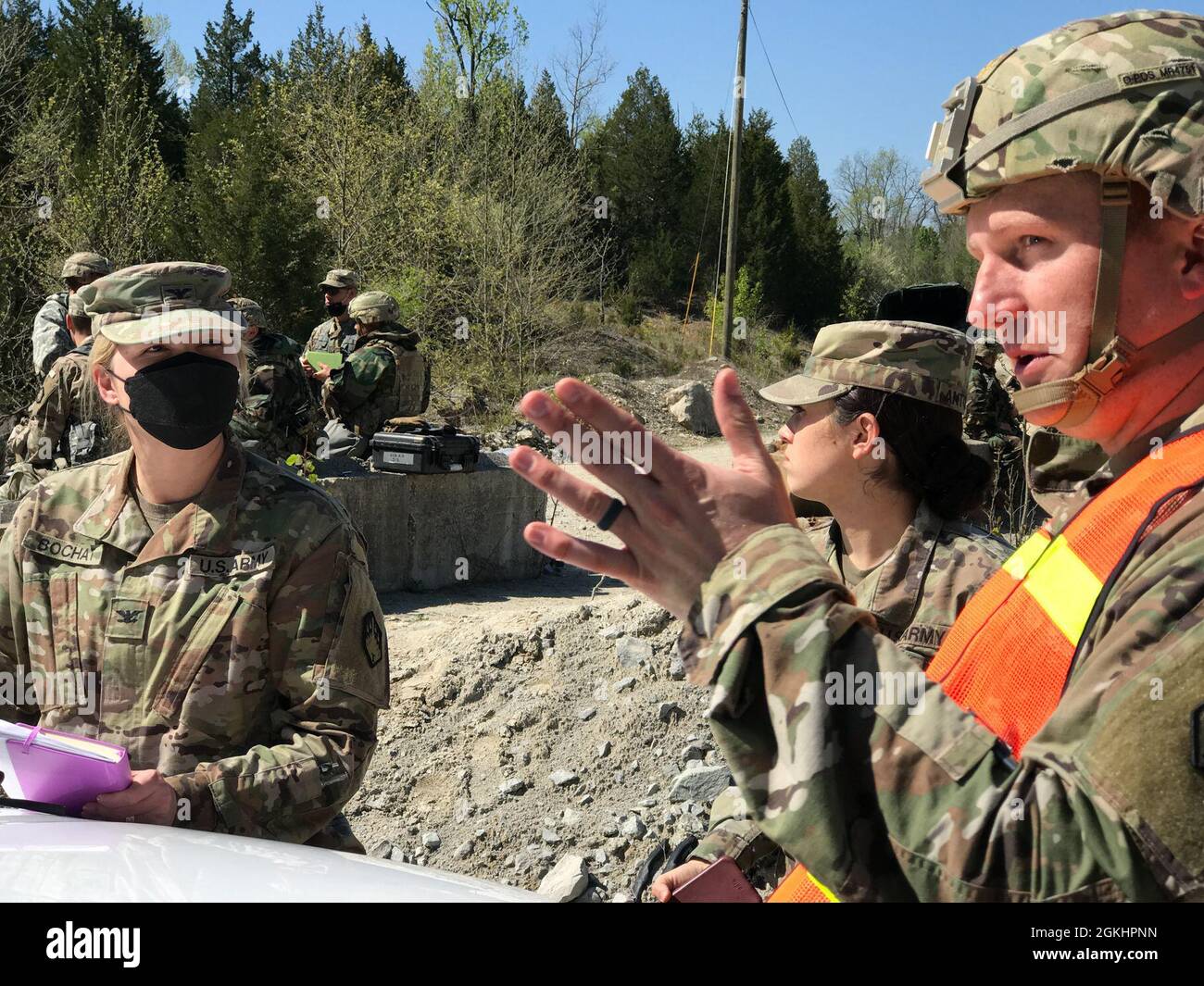 Commander of the 48th Chemical Brigade, Col W.M. Bochat, receives a ...