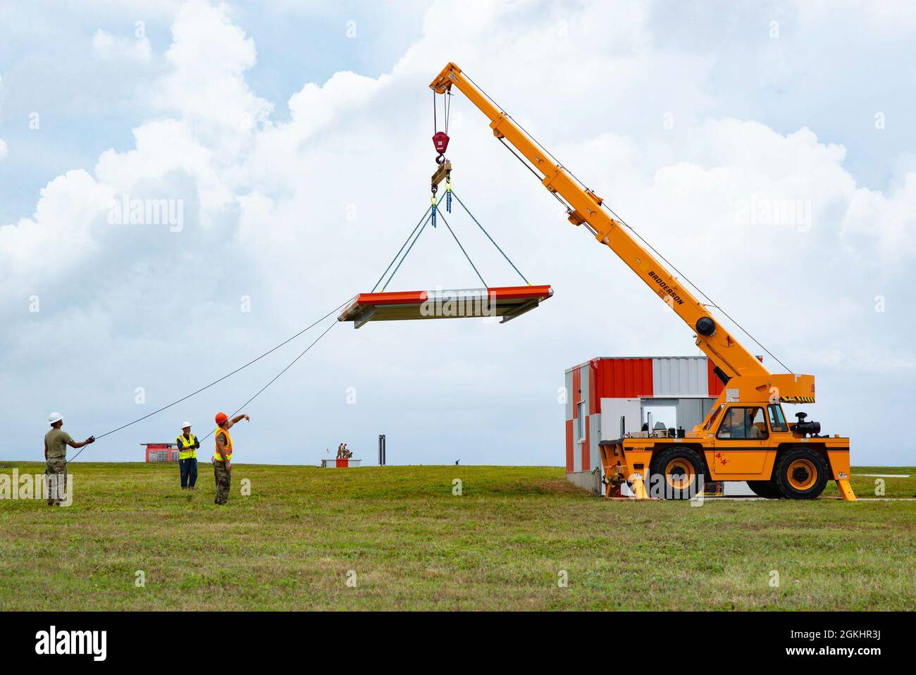 Members of the 36th Civil Engineer Squadron remove the roof of one of ...