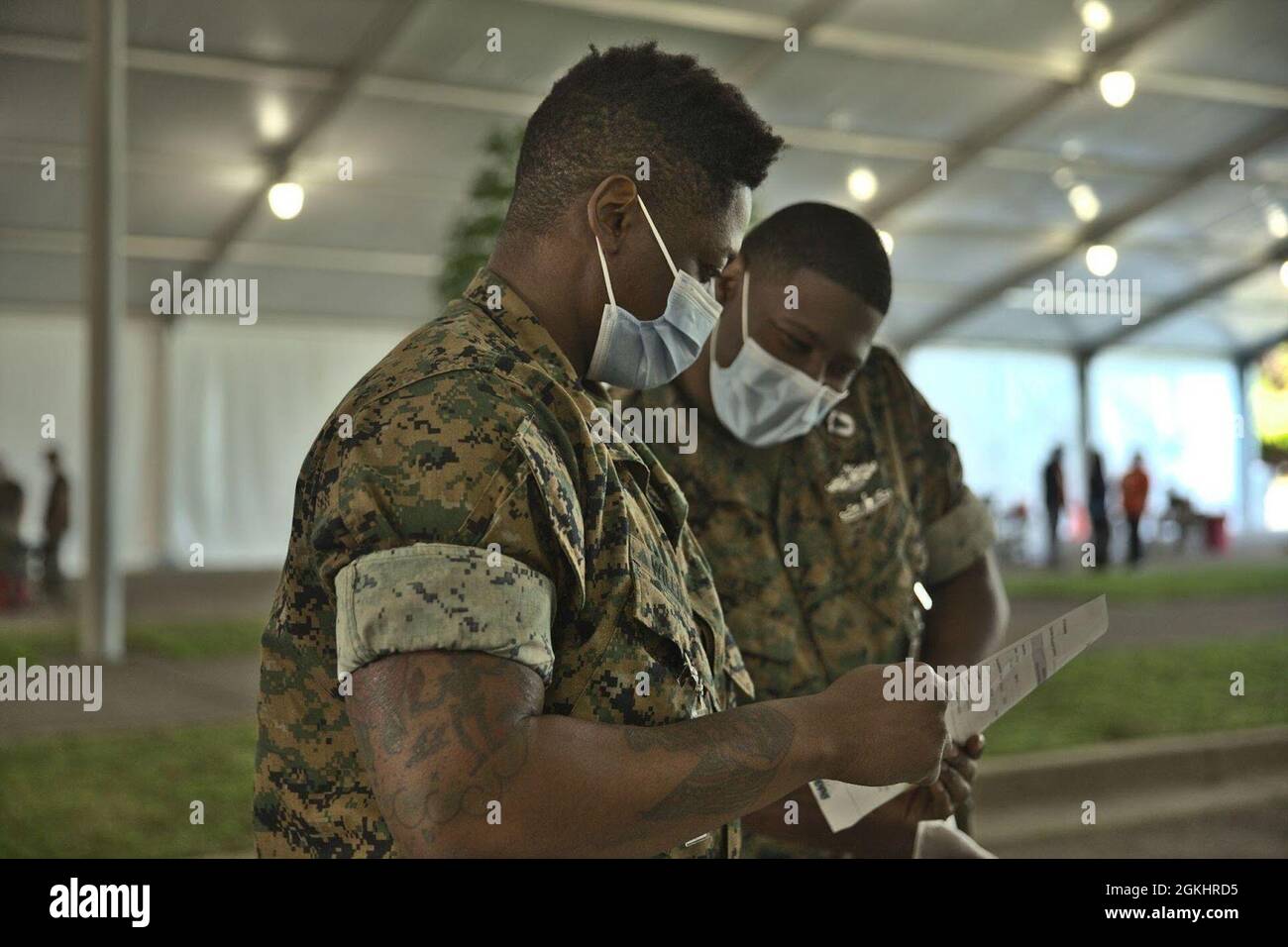 U.S. Navy Petty Officer 3rd Class Emille Williams and U.S. Navy Petty ...